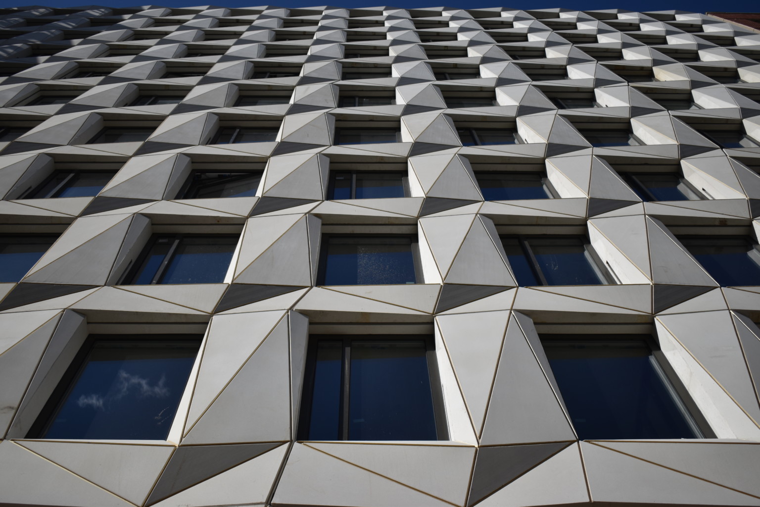 DXA Studio’s ‘The Maverick’ wraps up facade install of acid-etched ...